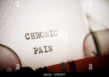 Chronic pain text written with a typewriter Stock Photo - Alamy