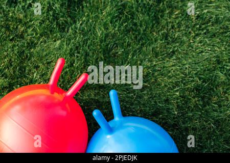 two bouncing balls or hoppers on grass Stock Photo - Alamy