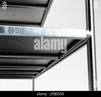 A simple stainless steel and chrome hospital or mortuary gurney with ...