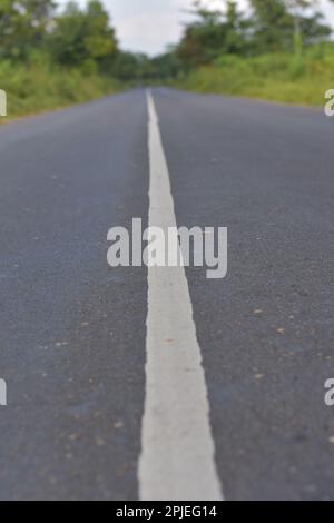 Road with white line in middle with no vehicle Stock Photo - Alamy
