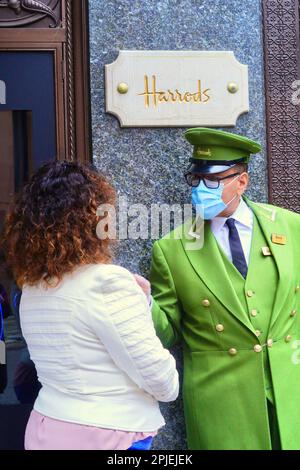 Famous Harrod's Doorman with distinctive bright green, gold buttoned ...