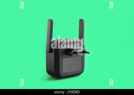 Black WiFi repeater on green background Stock Photo - Alamy
