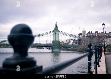 London- February 2023: Hammersmith Bridge from the Thames Path outside ...