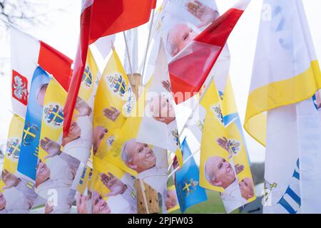 Krakow, Poland. 02nd Apr, 2023. The flags and the picture of Pope John ...