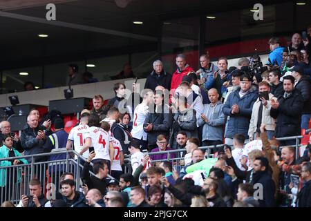 Bolton Wanderers players lift the trophy during the Papa John's Trophy ...