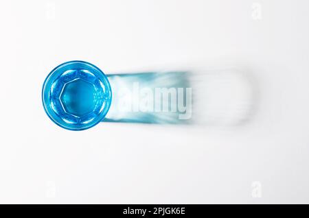 A Glass with Water and Sharp Shadows, Caustic Effect as Light Passes ...
