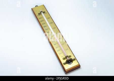 An old thermometer containing a red spirit based liquid which goes up a ...