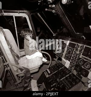 KN-C27689 31 March 1963 John F. Kennedy, Jr. sitting in the pilot's ...