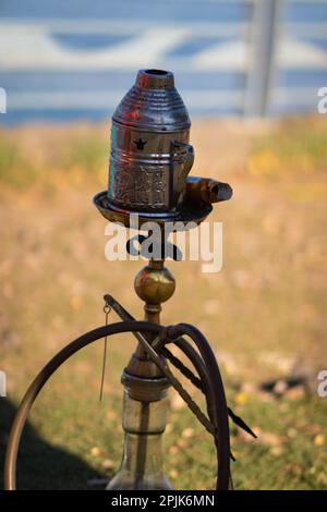 A real Syrian hookah on a beach in the Sea of Galilee - Israel. Blurred ...