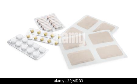 Mustard plasters and pills on white background Stock Photo - Alamy