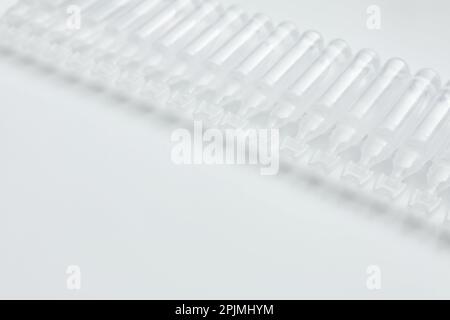 Single dose ampoules of sterile isotonic sea water solution on white ...