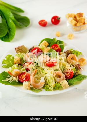 A delicious vegan salad with tomatoes, shrimps, and other ingredients ...