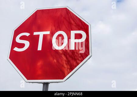 roadside red stop sign on a cloudy background. Sign isolated Stock ...