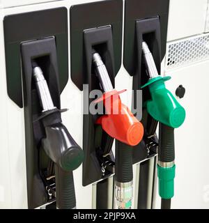 Fuel nozzles on filling station Stock Photo - Alamy