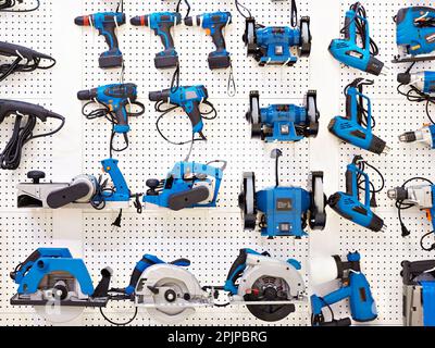 Drills and electrical tools on shelves in hardware store Stock Photo ...