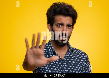 Indian man say No hold palm folded crossed hands in stop gesture ...