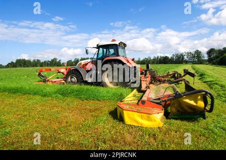 Mowing grass silage with Steyr tractor and Fella front and rear mower ...