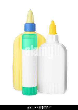 Different bottles and stick of glue on white background Stock Photo - Alamy
