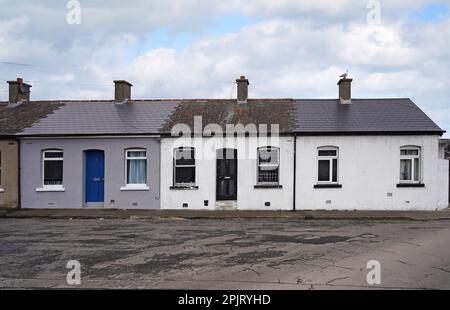 Row of small working class one story houses Stock Photo - Alamy