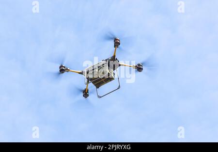 The Tactical Resupply Unmanned Aircraft System (TRUAS) drops a ...