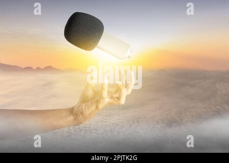 A human hand trying to reach a microphone. World press freedom day ...