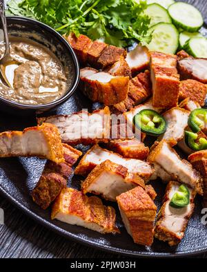 close-up of Lechon Kawali, filipino crispy fried pork belly with liver ...