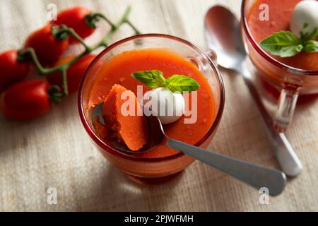 Tomato flan made with gelatin and a small ball of mozzarella Stock ...