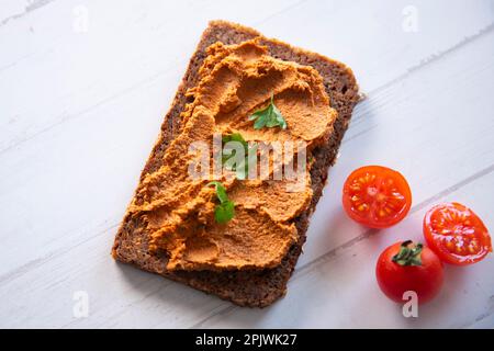 Toast with vegetarian pate made with dried tomato and other vegetables ...