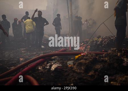 Firefighters work to extinguish a fire that broke out at Wang Fuk Court ...
