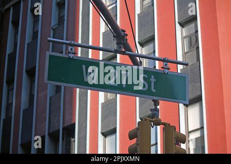 Green big West 26th Street sign hanging on a arch pole in the streets ...