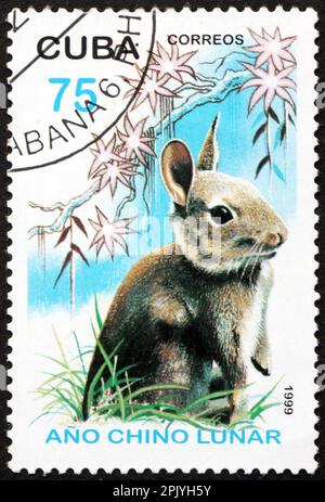 CUBA - CIRCA 1999: a stamp printed in Cuba shows three galloping horses ...