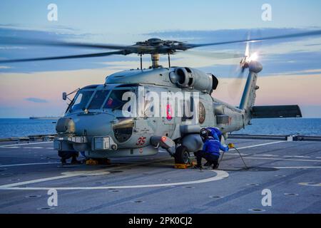 NATUNA SEA (Mar. 26, 2023) An MH-60R SeaHawk, attached to Helicopter ...