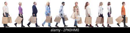a group of people are running paper shopping bags Stock Photo - Alamy