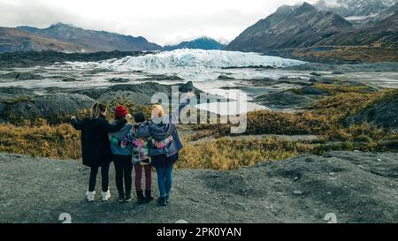 Aerial view of girls on Matanuska Glacier State Recreation Area in ...