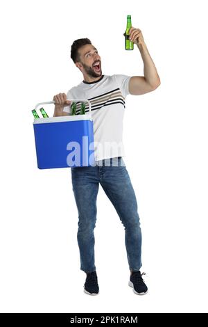 Happy man with cool box and bottles of beer on white background Stock ...