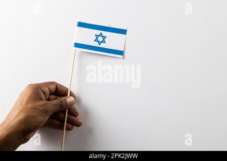 Close up of biracial man holiday flag of israel with copy space on ...
