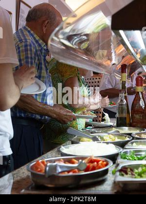 customers seen on a buffet in a celebration Stock Photo - Alamy