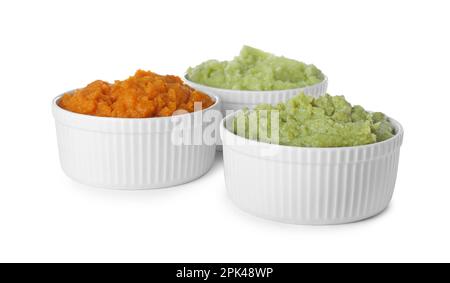 Different delicious puree in bowls on white background, top view ...