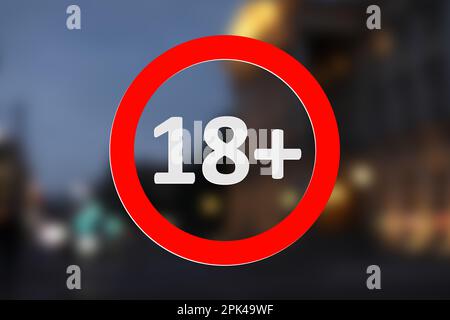 Age limit sign 18+ years and blurred view of night city Stock Photo - Alamy