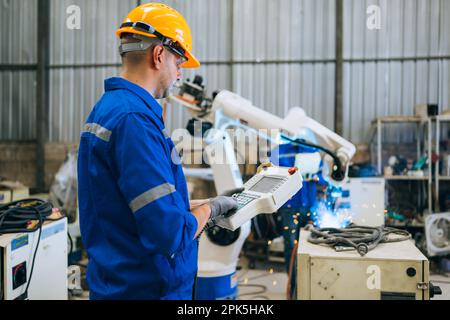 Engineer technician controlling robotic arms on computer laptop Stock ...
