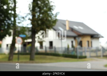 Blurred view of beautiful house behind fence Stock Photo - Alamy