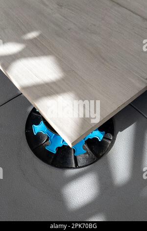 plots pavement grey tiles installation on house terrace with adjustable ...