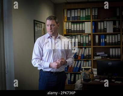 John Finucane , Irish lawyer and Sinn Féin politician in front of a ...