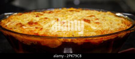 Traditional Brazilian recipe known as "escondidinho" of dried meat with ...