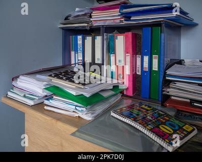 Untidy home office desk Stock Photo - Alamy