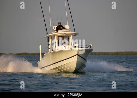 A center console fishing boat approaching head-on at high speed Stock ...