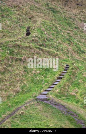 Steps in the steep cliff walk to Kinbane Castle ruins, Ballycastle, UK ...