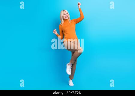 Photo of crazy excited girl dance night club raise hands enjoy rejoice ...