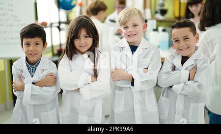Group of kids scientists students smiling confident standing with arms ...
