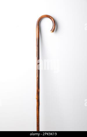 Elegant wooden walking cane on white background Stock Photo - Alamy